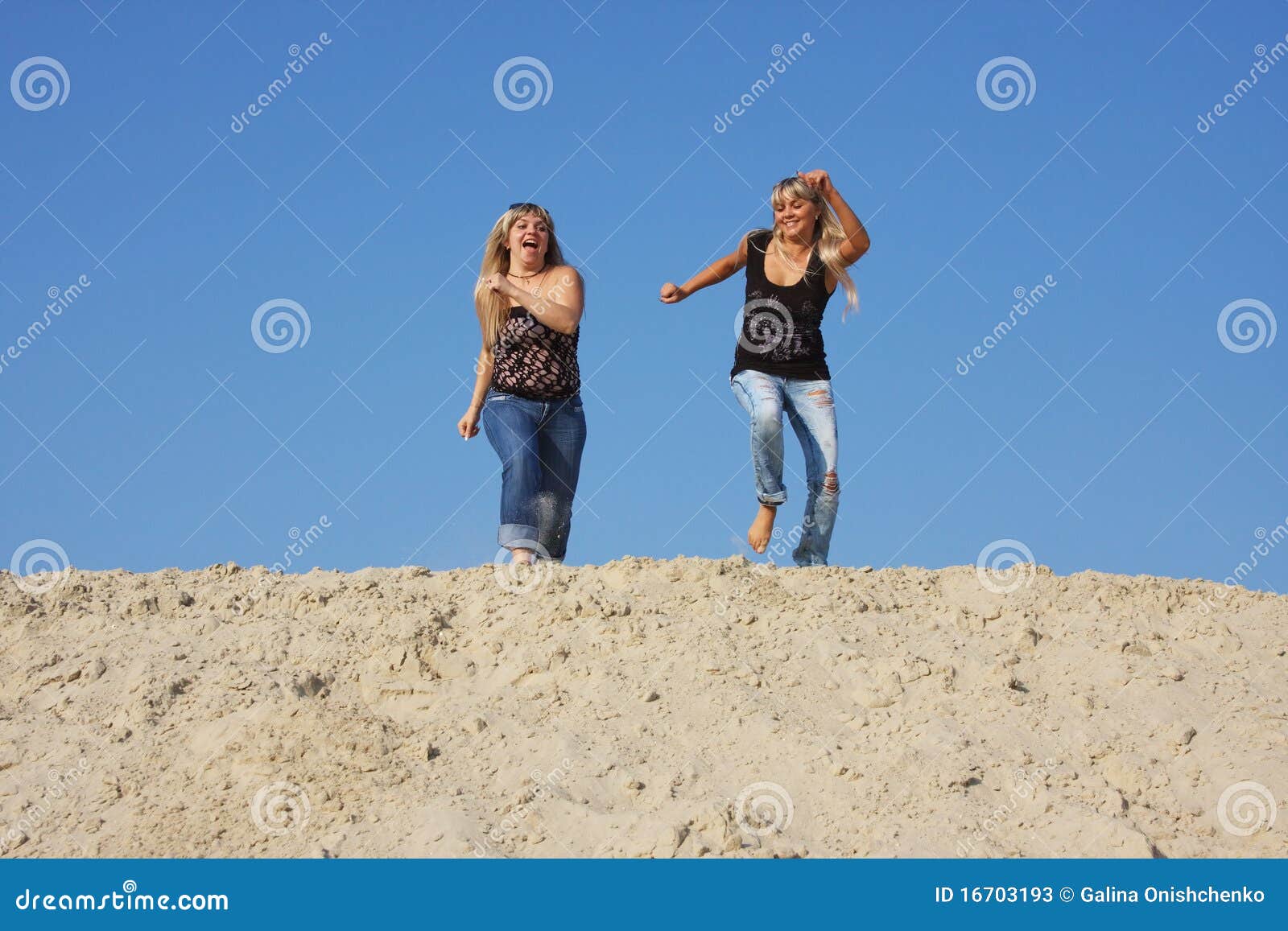 Two Young Girls on a Sand-pit Stock Image - Image of blonde, jump: 16703193