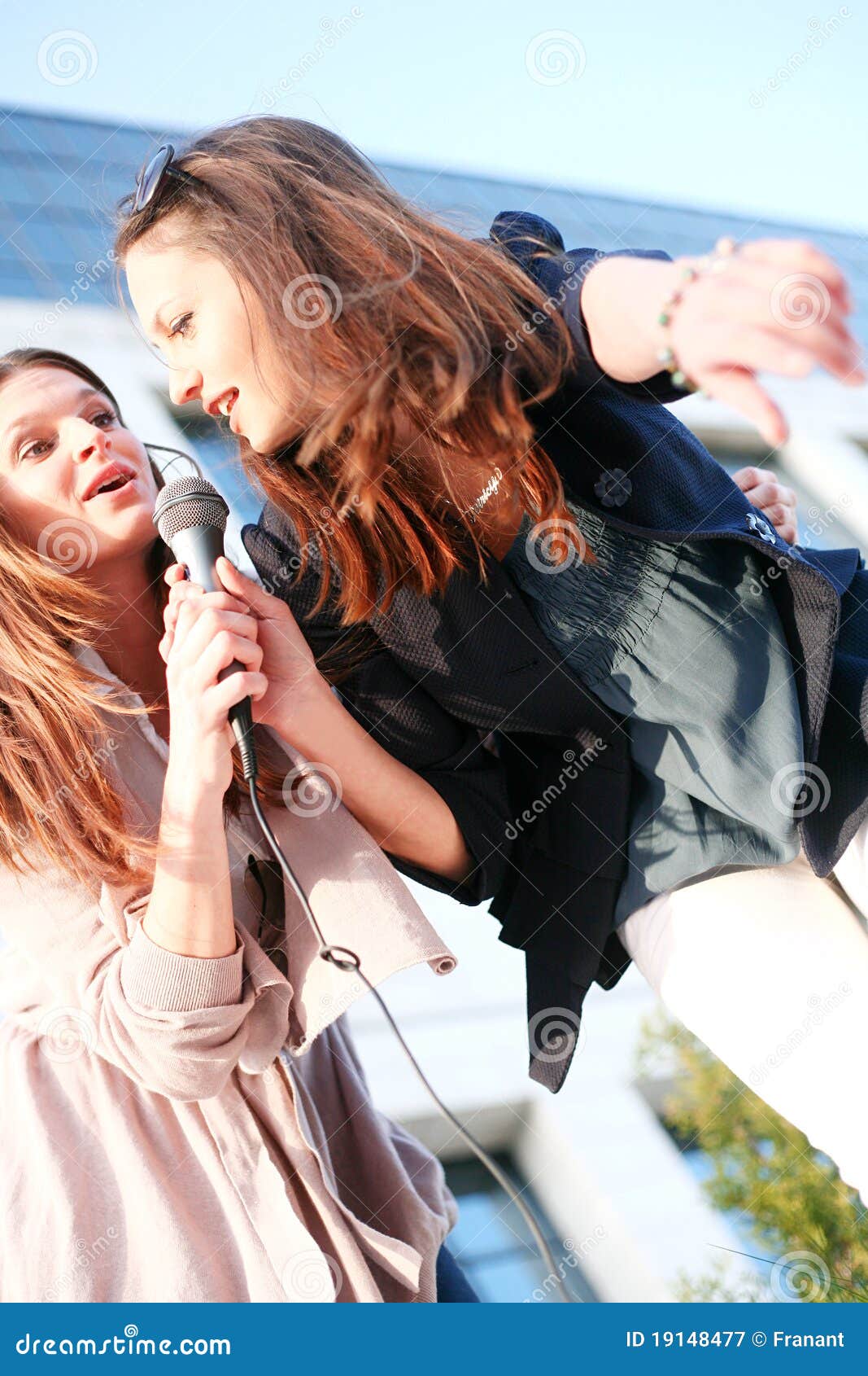 Two Young Girls Singing Karaoke Stock Image - Image of sound, exciting ...