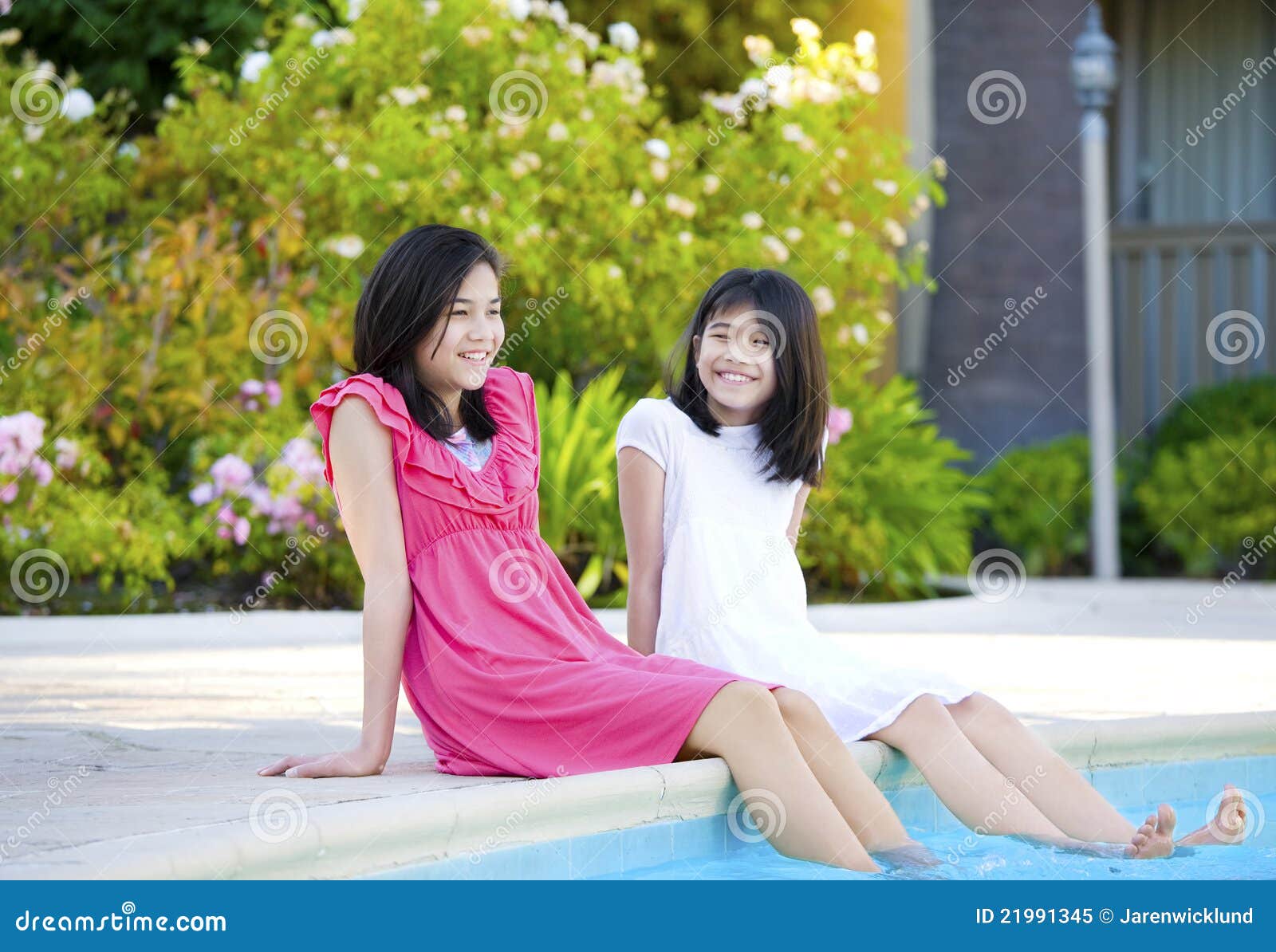 Two Young Girls Sitting by Swimming Pool, Smiling Stock Image - Image ...