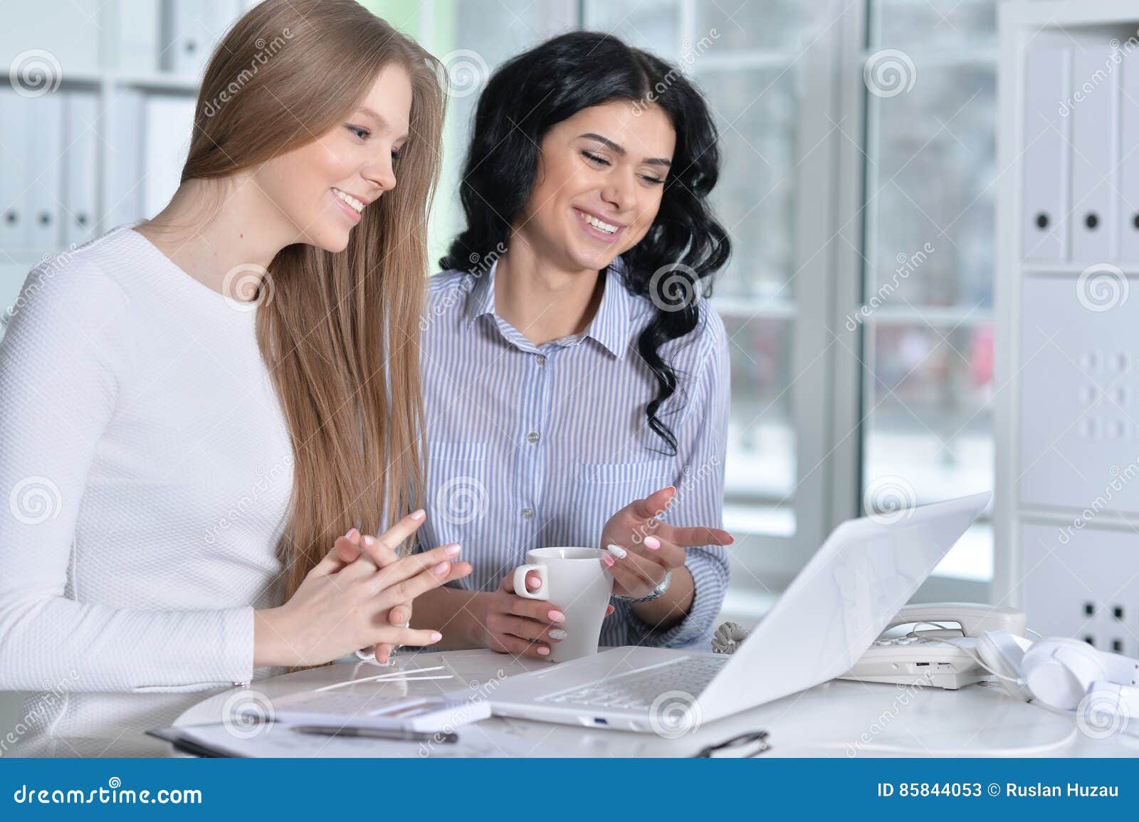 Two young girls working stock image. Image of real, modern - 85844053