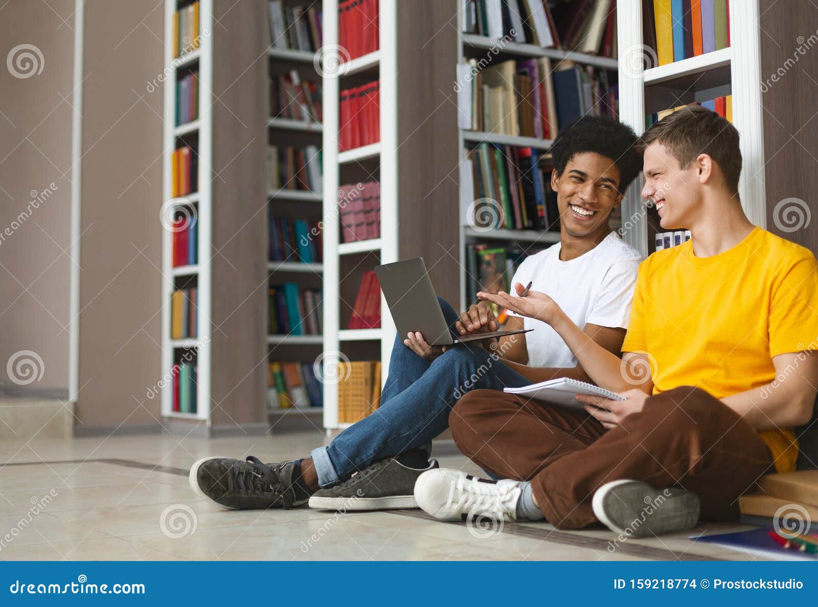 Two Young Guys Having Fun while Studying at Library Stock Photo - Image ...