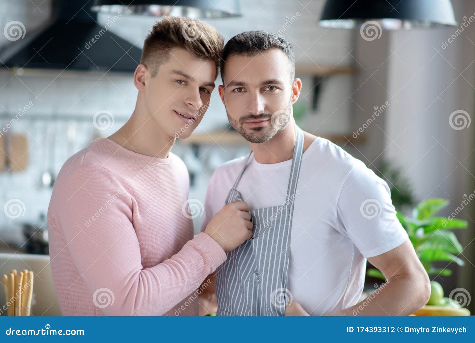 Two Young Guys Standing Close Together in a Room. Stock Photo - Image ... Two Young Guys Standing Close Together in a Room. Stock Photo - Image ...