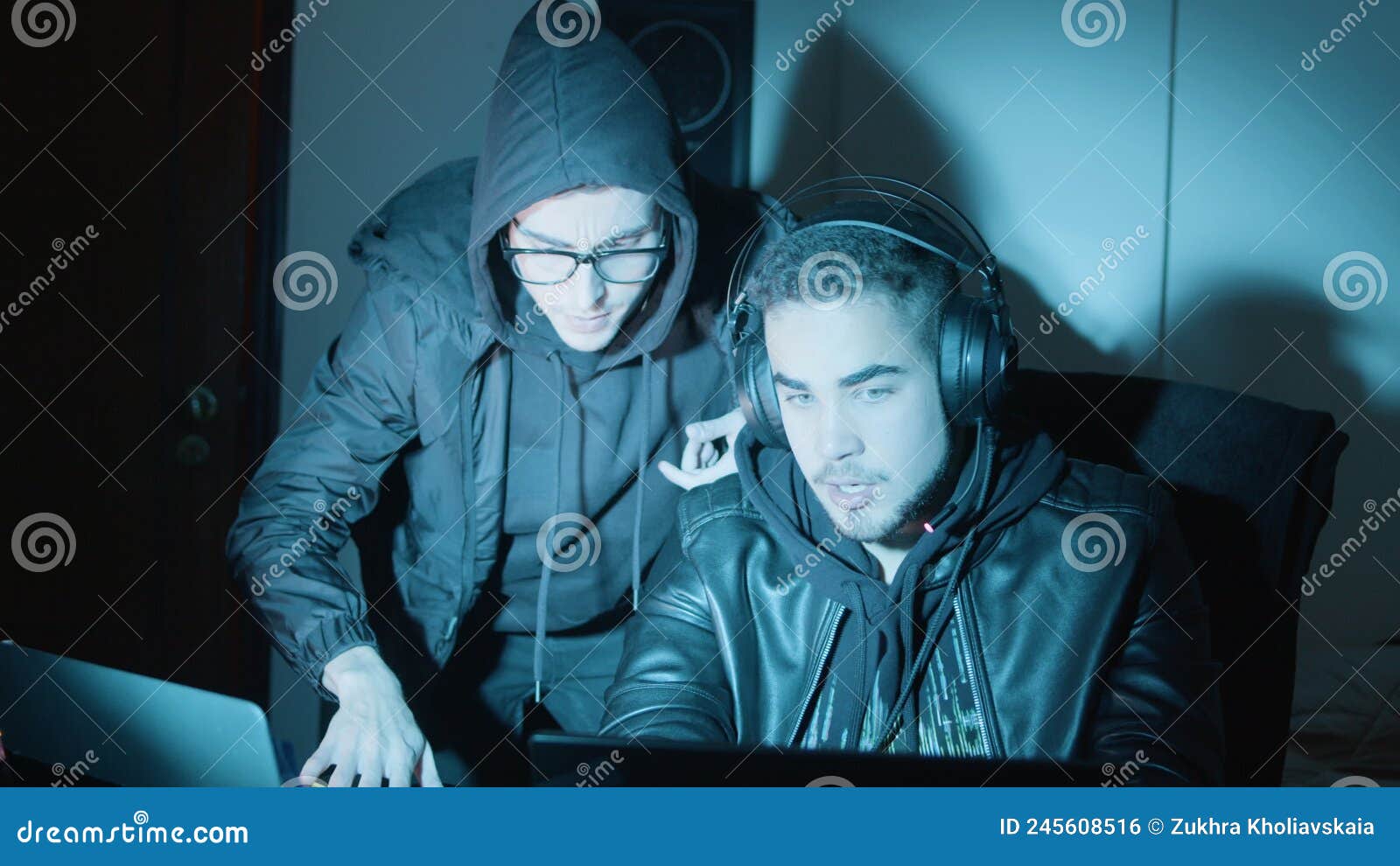 Two Young Guys Talking and Discussing Things while Hacking Stock ...