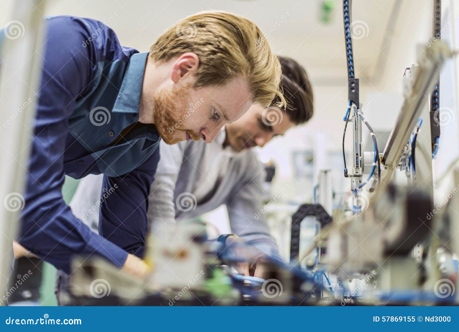 Two Young Handsome Engineers Working on Electronics Components Stock ...