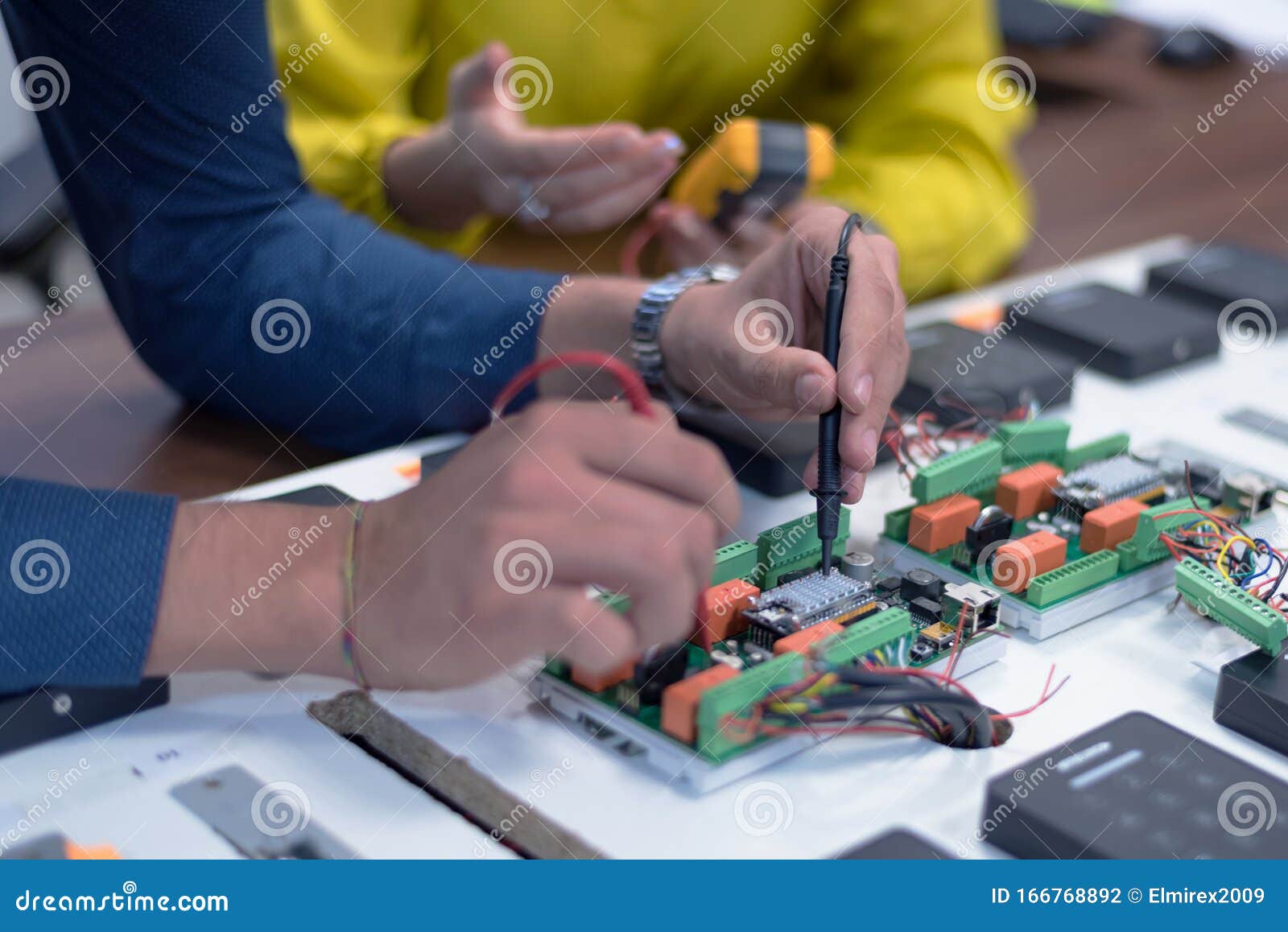 Two Young Handsome Engineers Working on Electronics Components.Tech ...