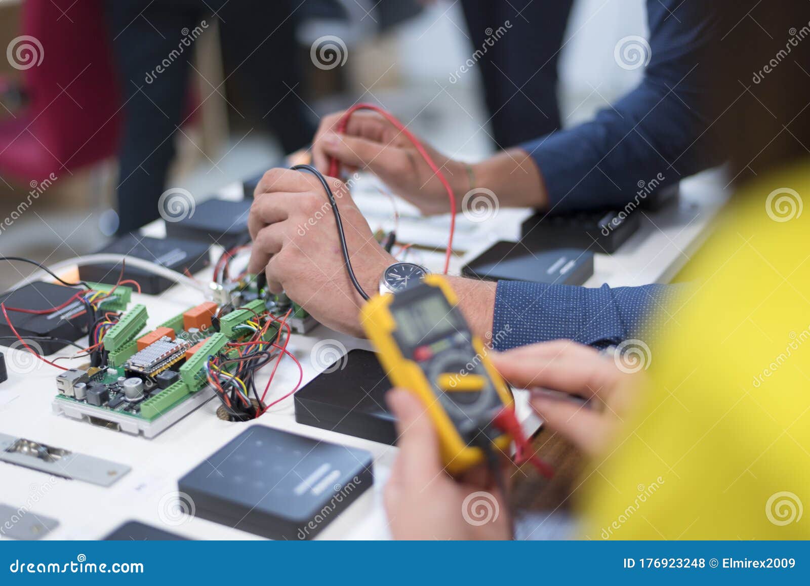 Two Young Handsome Engineers Working on Electronics Components.Tech ...