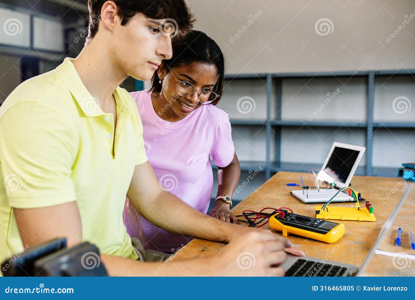 Two Young High School Students Learning Together at Technology Class ...