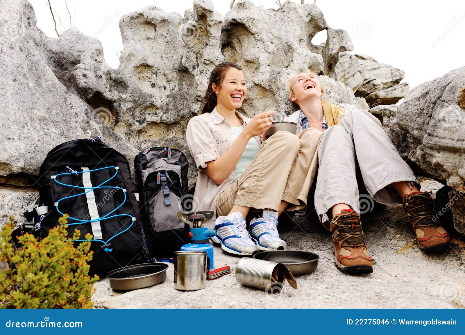 Two Young Hikers Relaxing after a Tough Day Hiking Stock Photo - Image ...