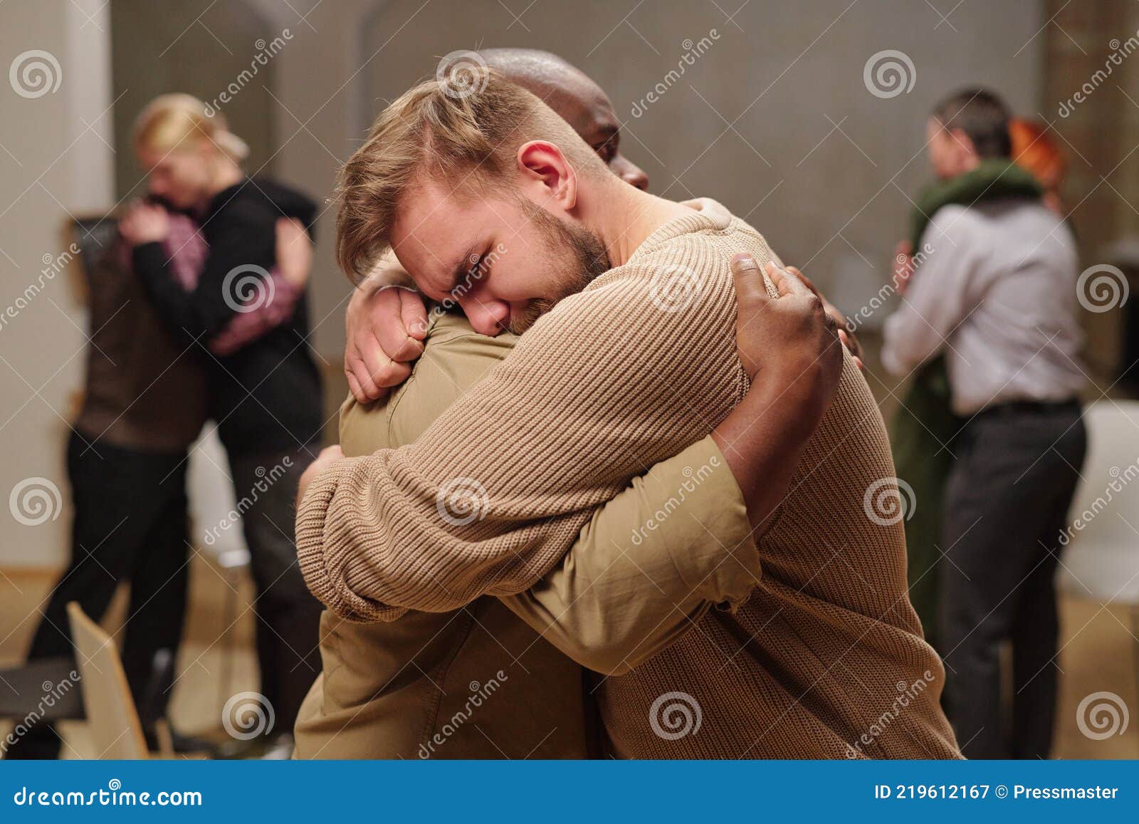 Two Young Intercultural Man Embracing while Supporting One Another ...