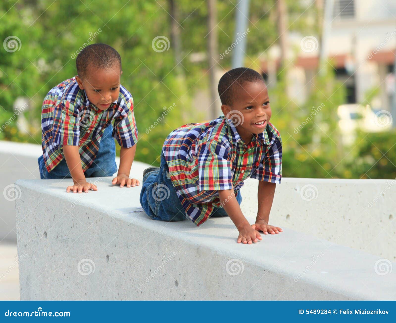 Two Young Kids Crawling on Ledge Stock Photo - Image of play, identical ...