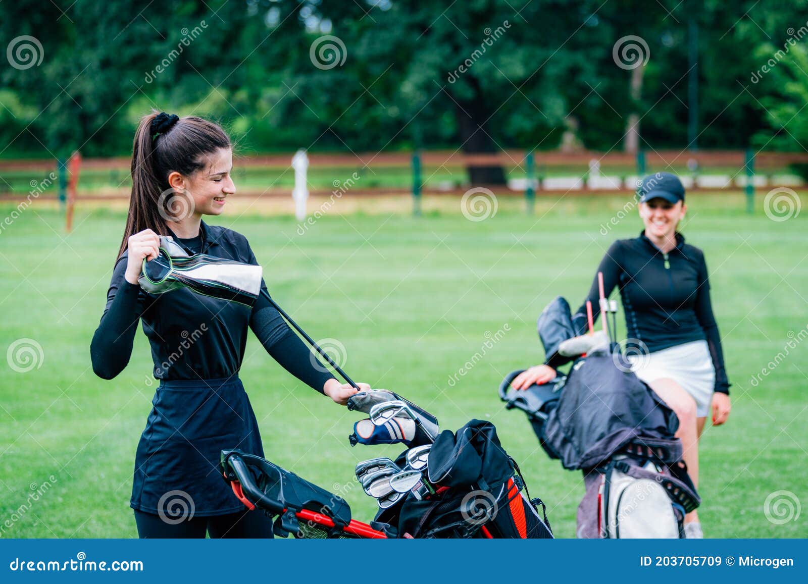 Two Young Ladies Playing Golf, Having Fun Stock Image - Image of golfer ...