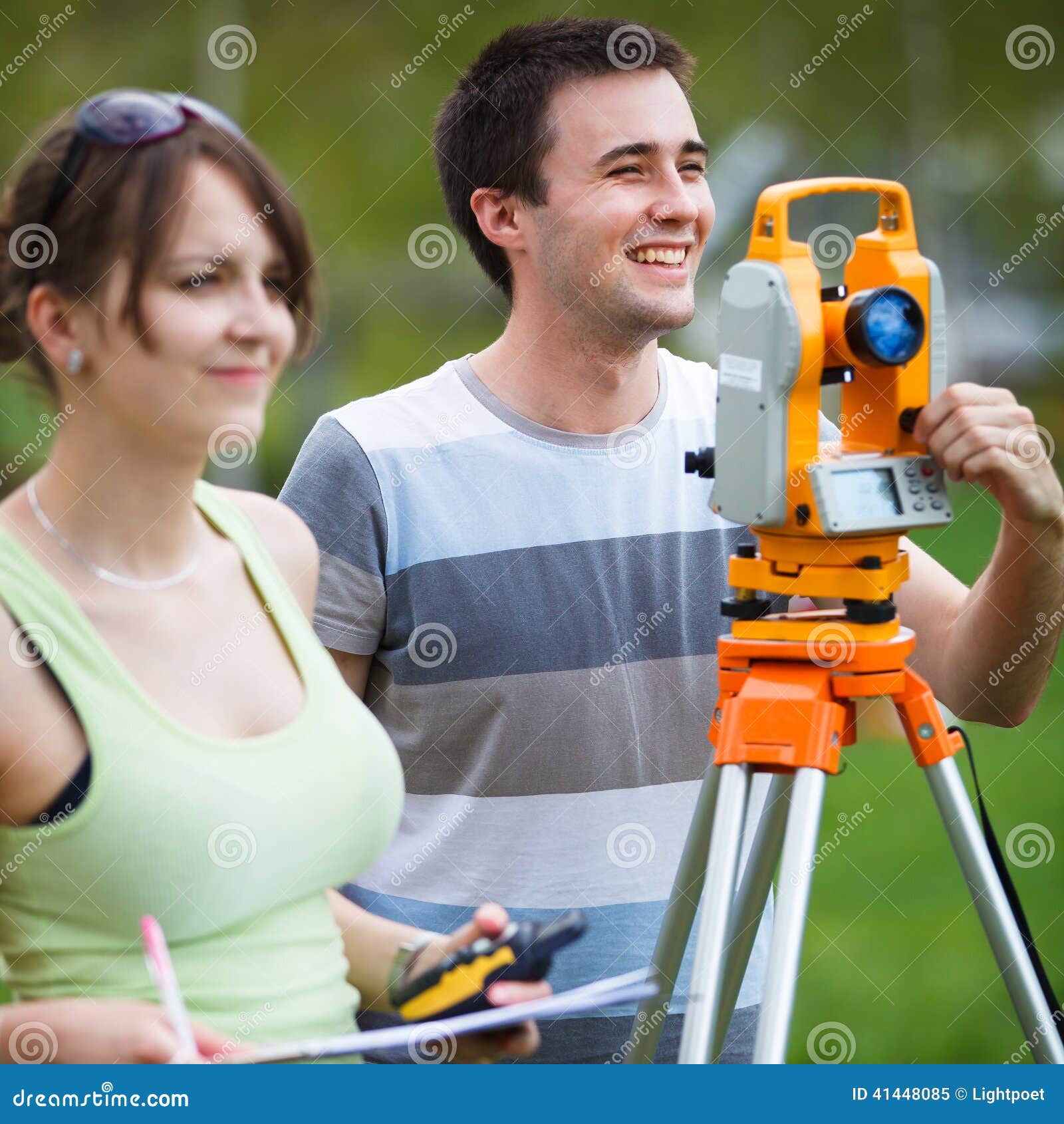 Two young land surveyors stock image. Image of blue, plane - 41448085