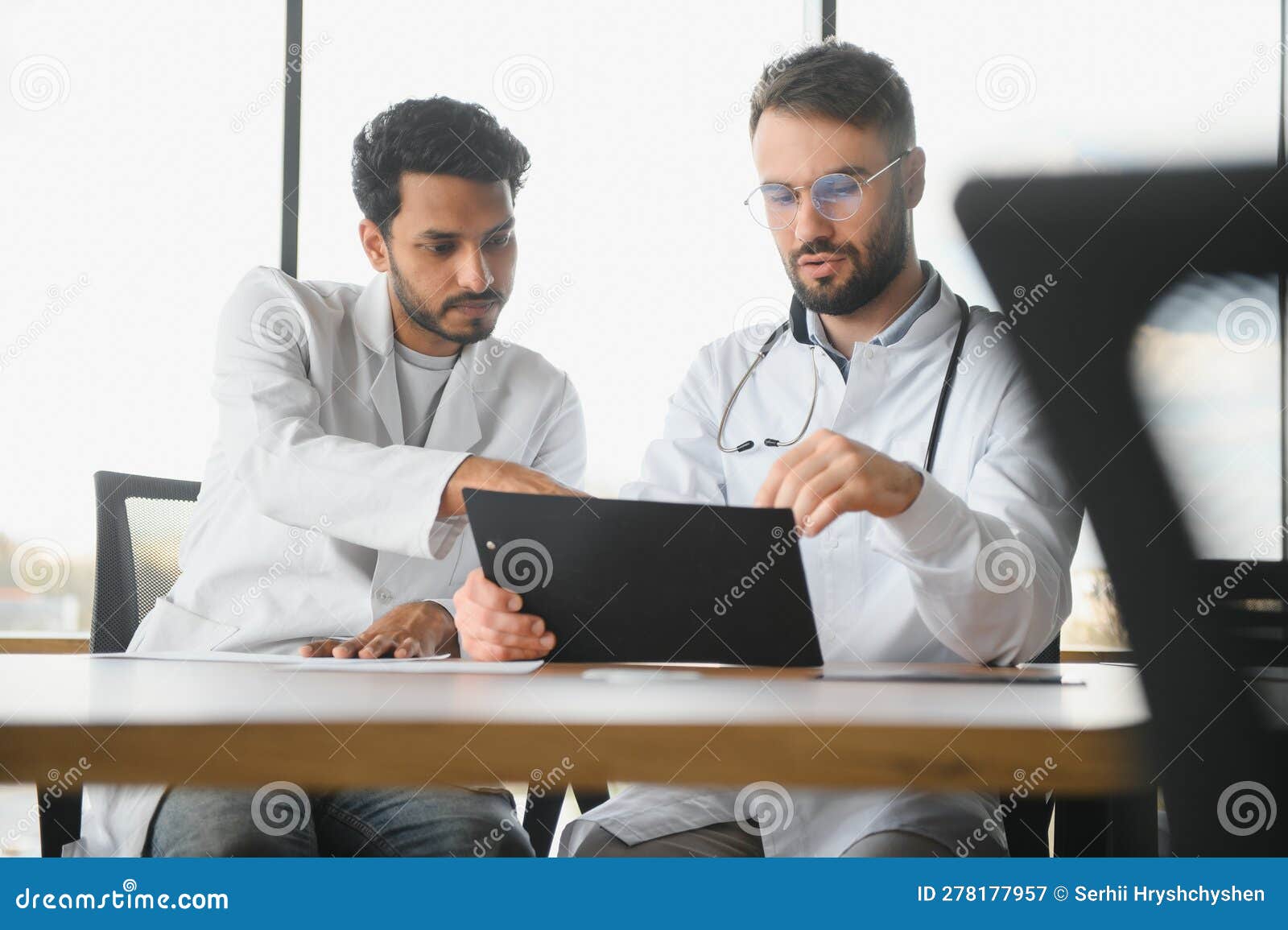 Two Young Male Doctors in the Clinic Stock Image - Image of male ...