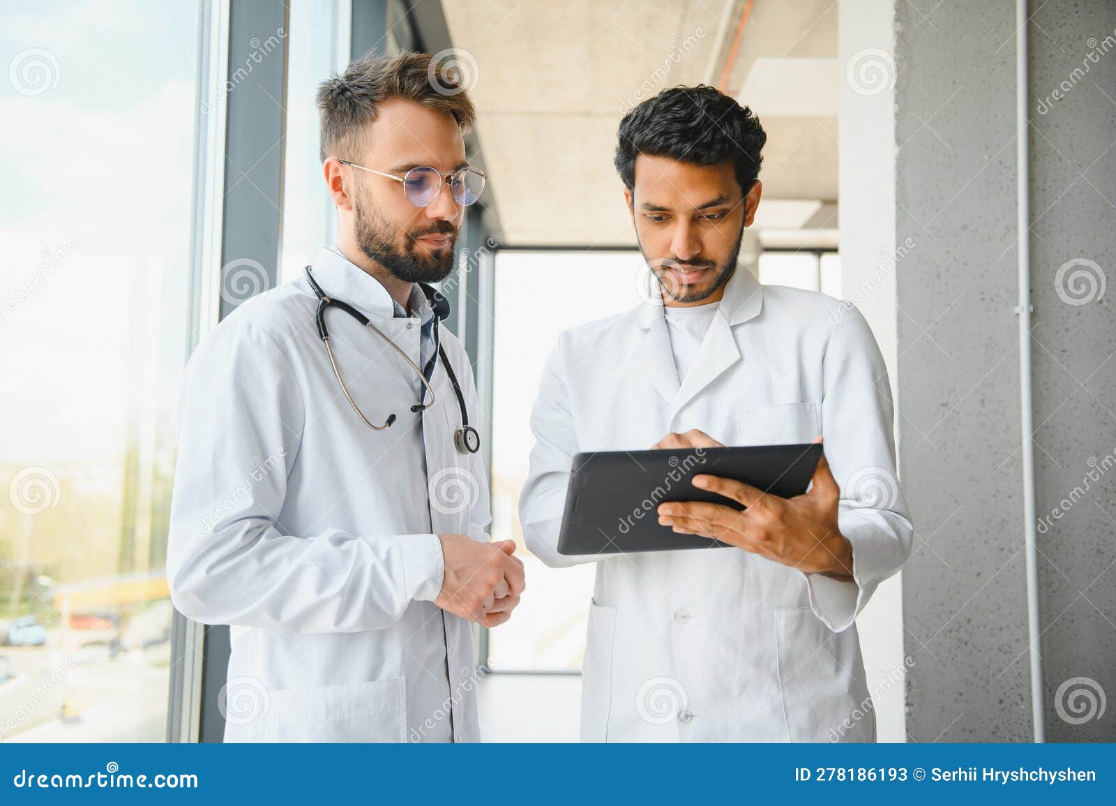 Two Young Male Doctors in the Clinic Stock Image - Image of worker ...