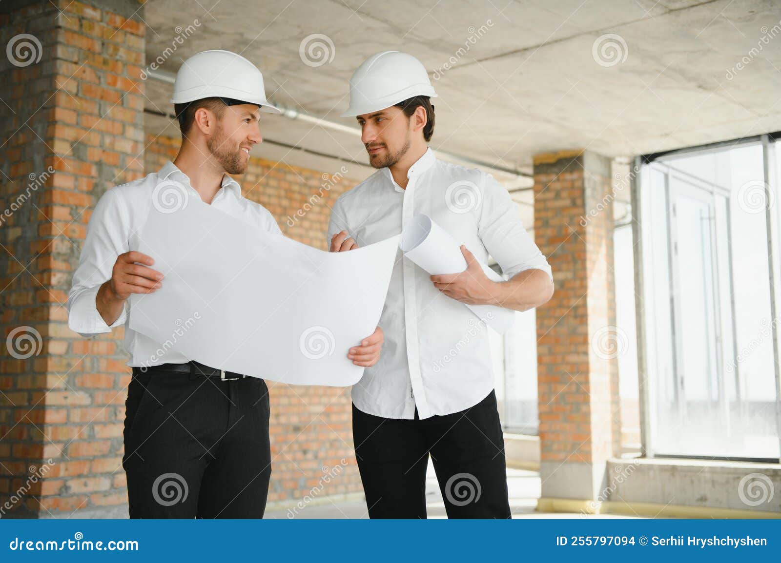 Two Young Man Architect on a Building Construction Site Stock Photo ...