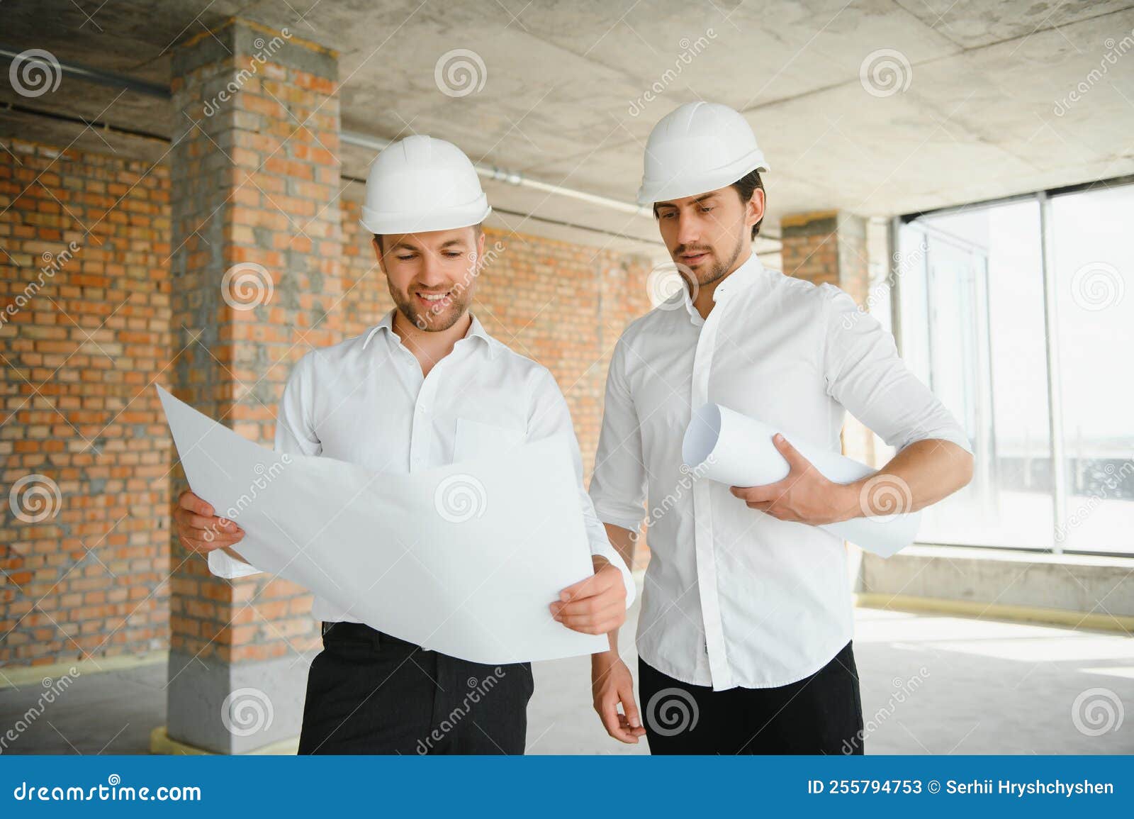 Two Young Man Architect on a Building Construction Site Stock Image ...