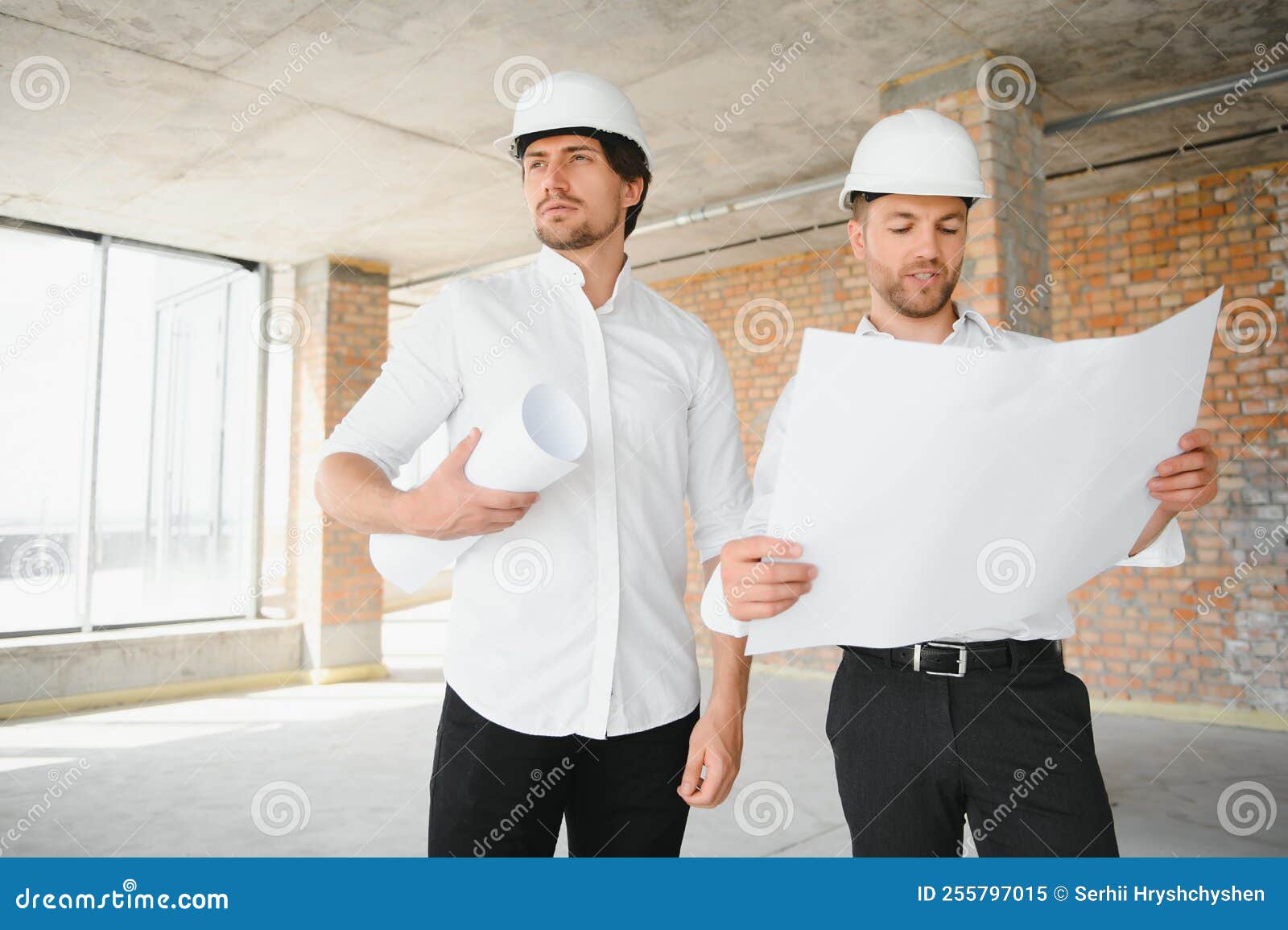 Two Young Man Architect on a Building Construction Site Stock Image ...