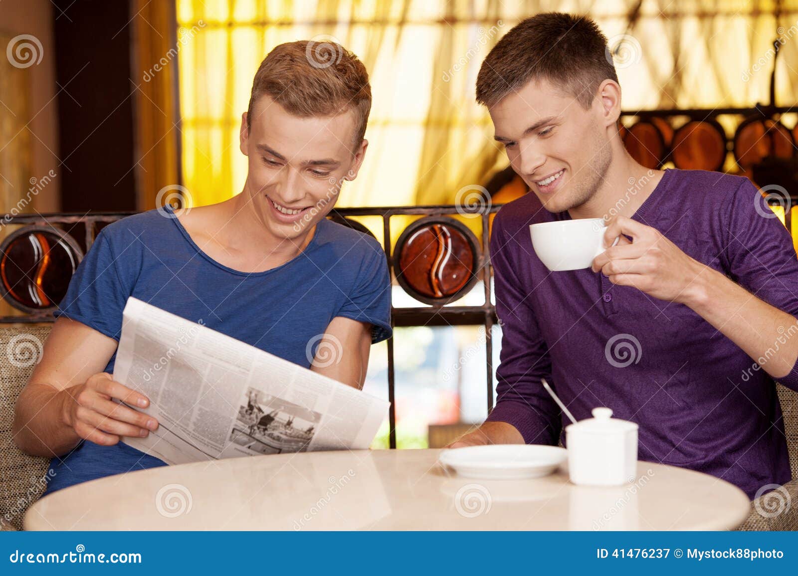 Two Young Man Reading Newspaper. Stock Image - Image of coffee, meeting ...