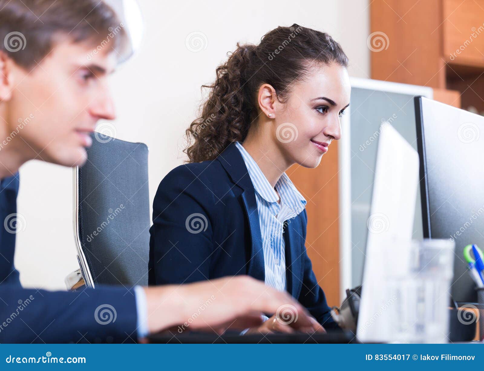 Two Young Managers Using Laptop at Work Stock Image - Image of smile ...