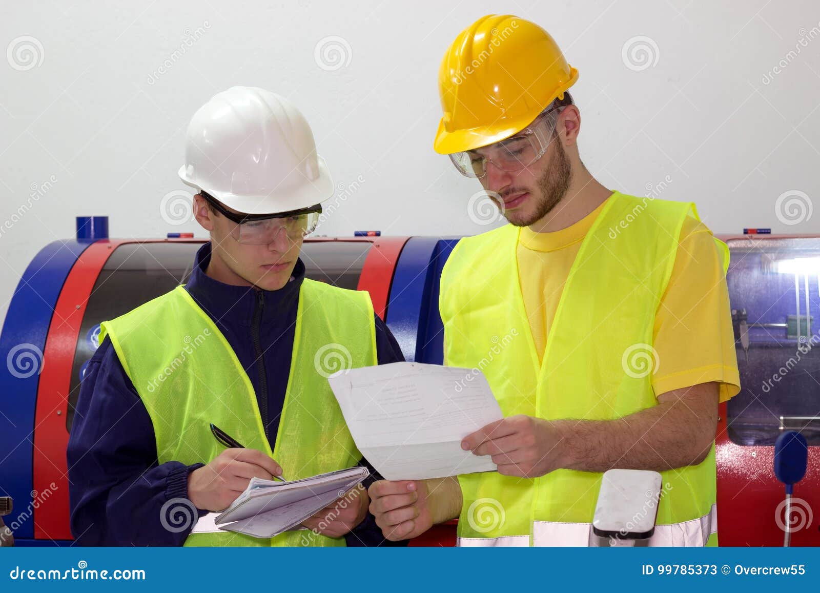 Two Young Mechanical Workers Stock Image - Image of metal, keypad: 99785373