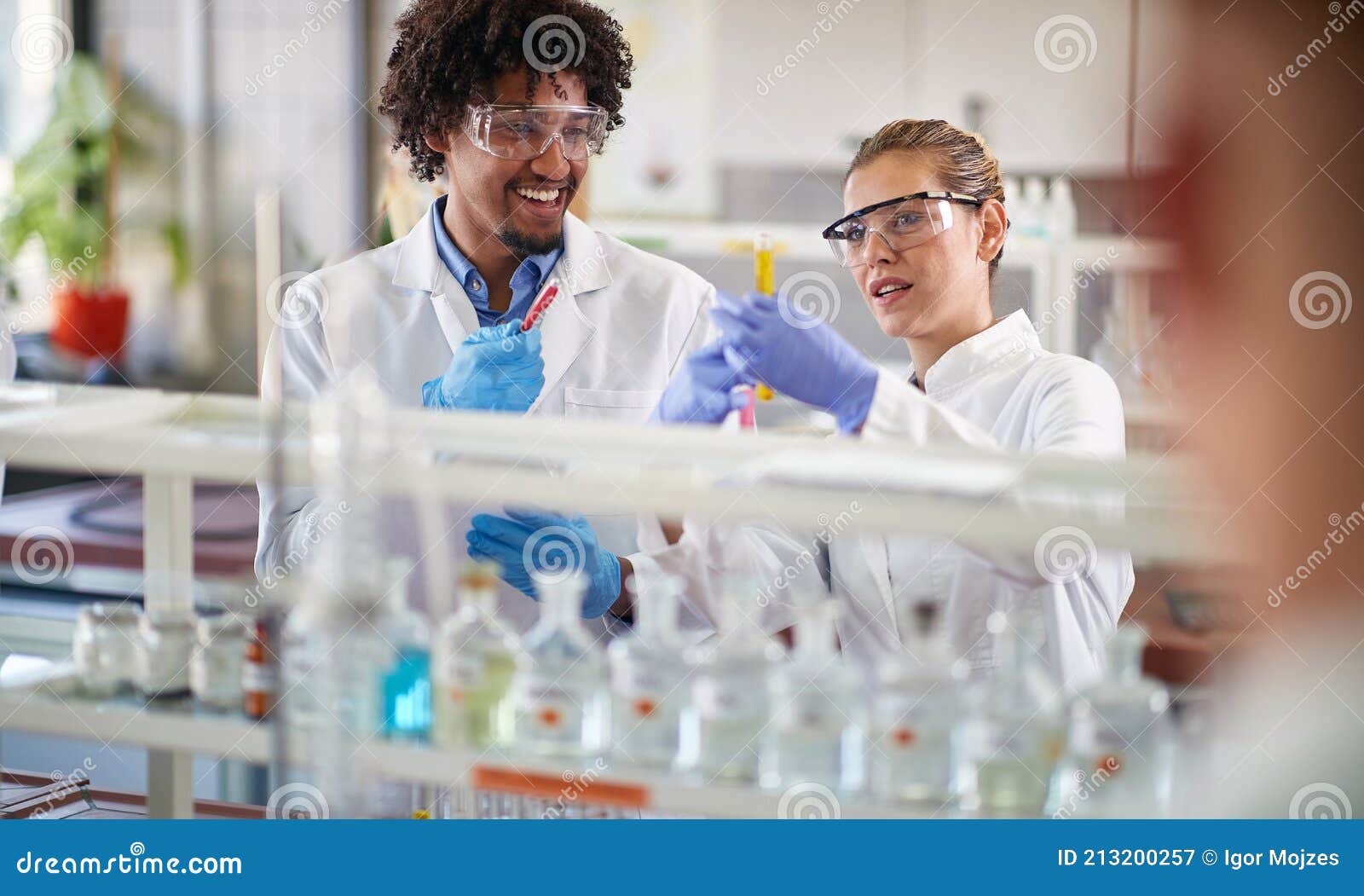 Two Young Medical Students Conducting Chemical Experiment Stock Image ...