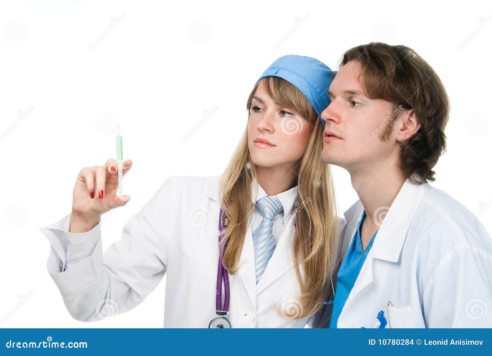 Two Young Medics are Looking at Syringe Stock Photo - Image of exam ...