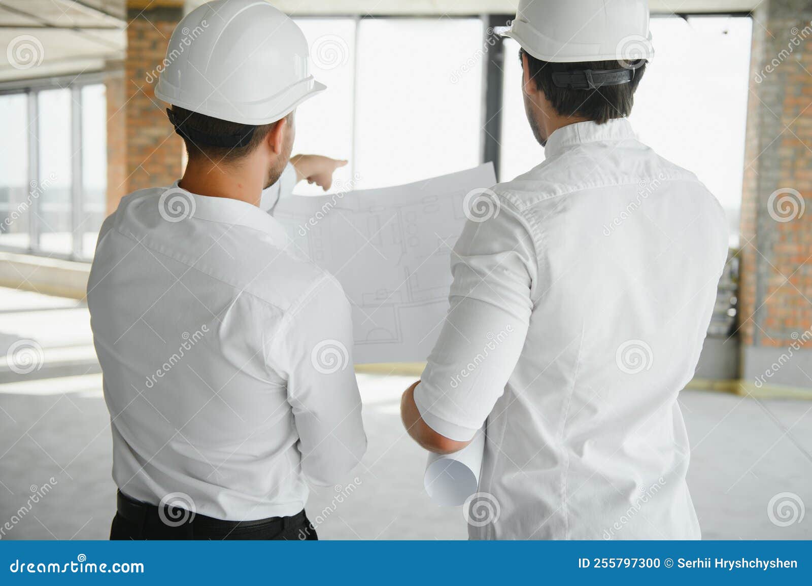 Two Young Man Architect on a Building Construction Site Stock Photo ...