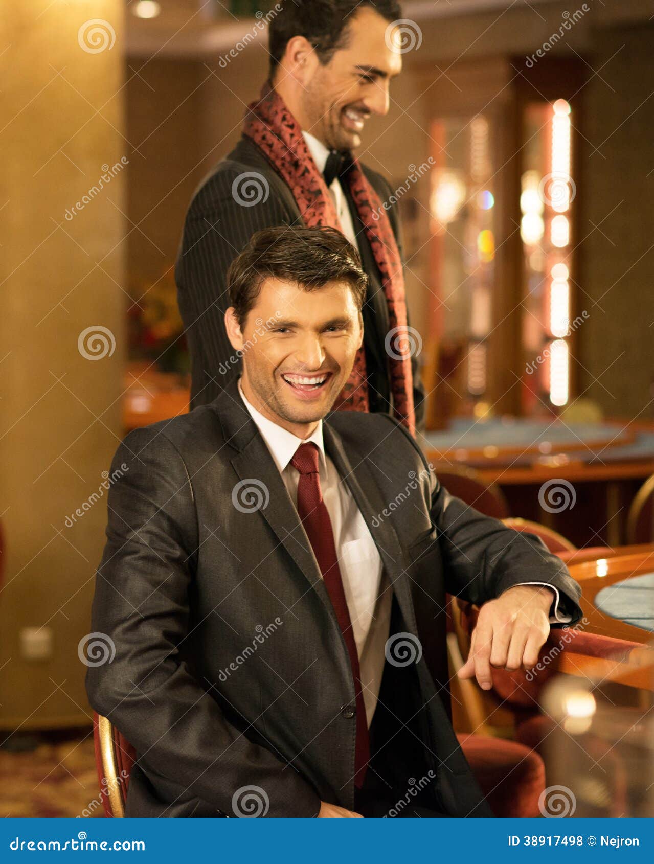 Two Young Men Behind Gambling Table Stock Photo - Image of rich, chips ...