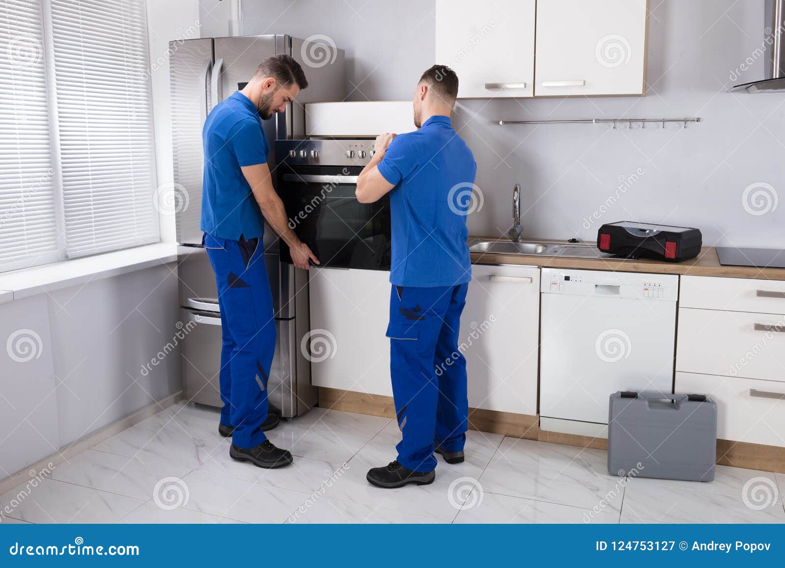 Two Men Fixing Oven in Kitchen Stock Image - Image of installation ...