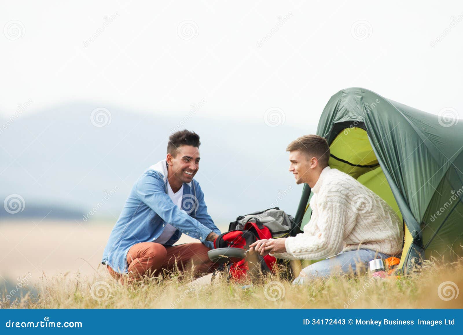 Two Young Men on Camping Trip in Countryside Stock Image - Image of ...