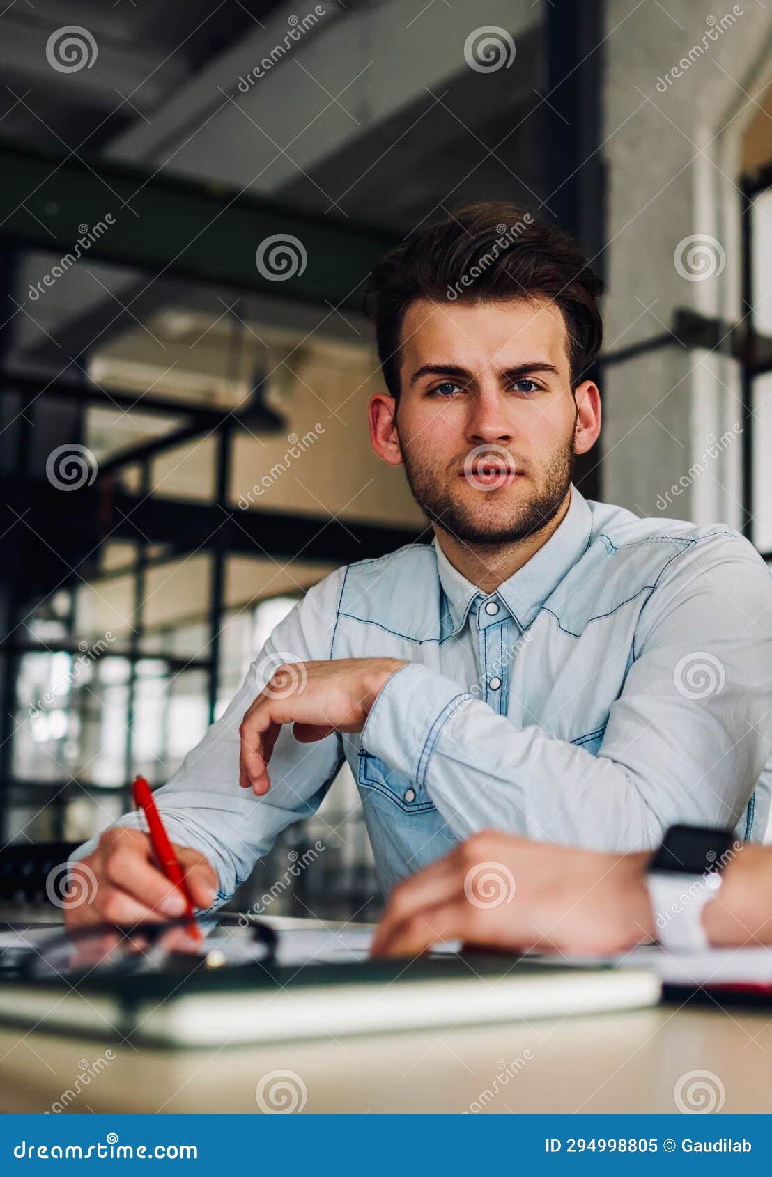 .Two Young Men Cooperating on Common Task Sitting at Desktop on Courses ...