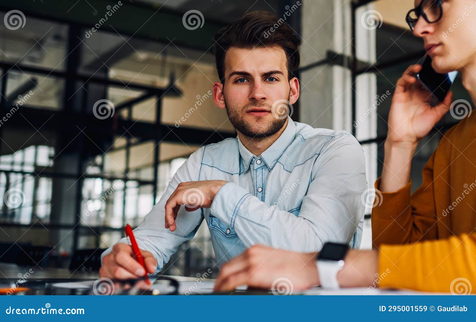 Two Young Men Cooperating on Common Task Sitting at Desktop on Courses ...
