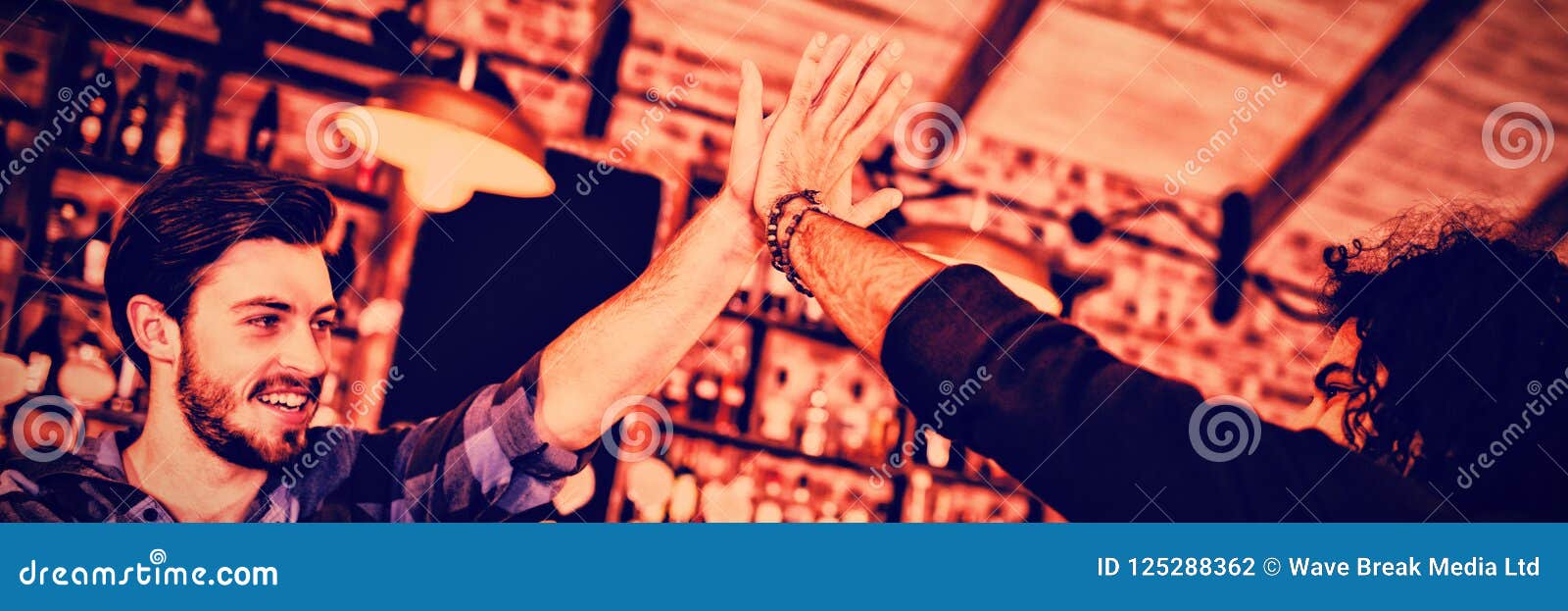Two Young Men Giving High Five To Each Other Stock Photo - Image of ...