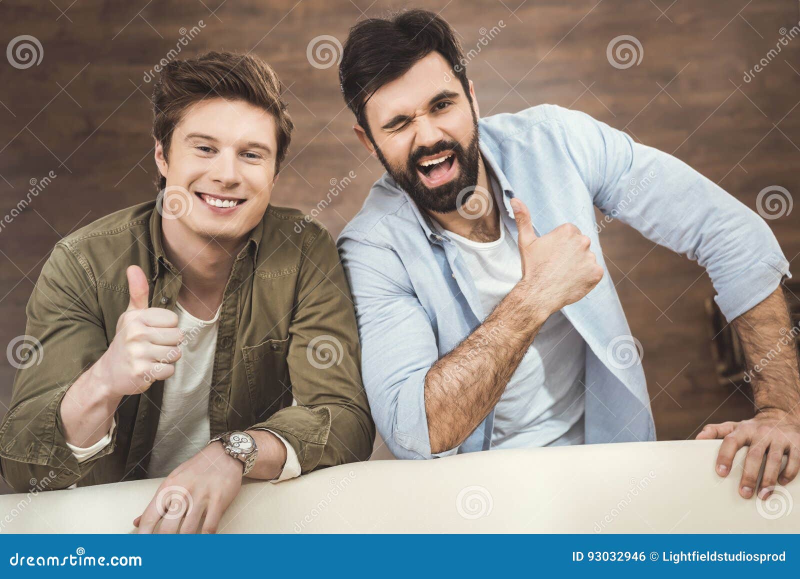 Two Young Men Leaning on Sofa Stock Photo - Image of beauty, smiling ...