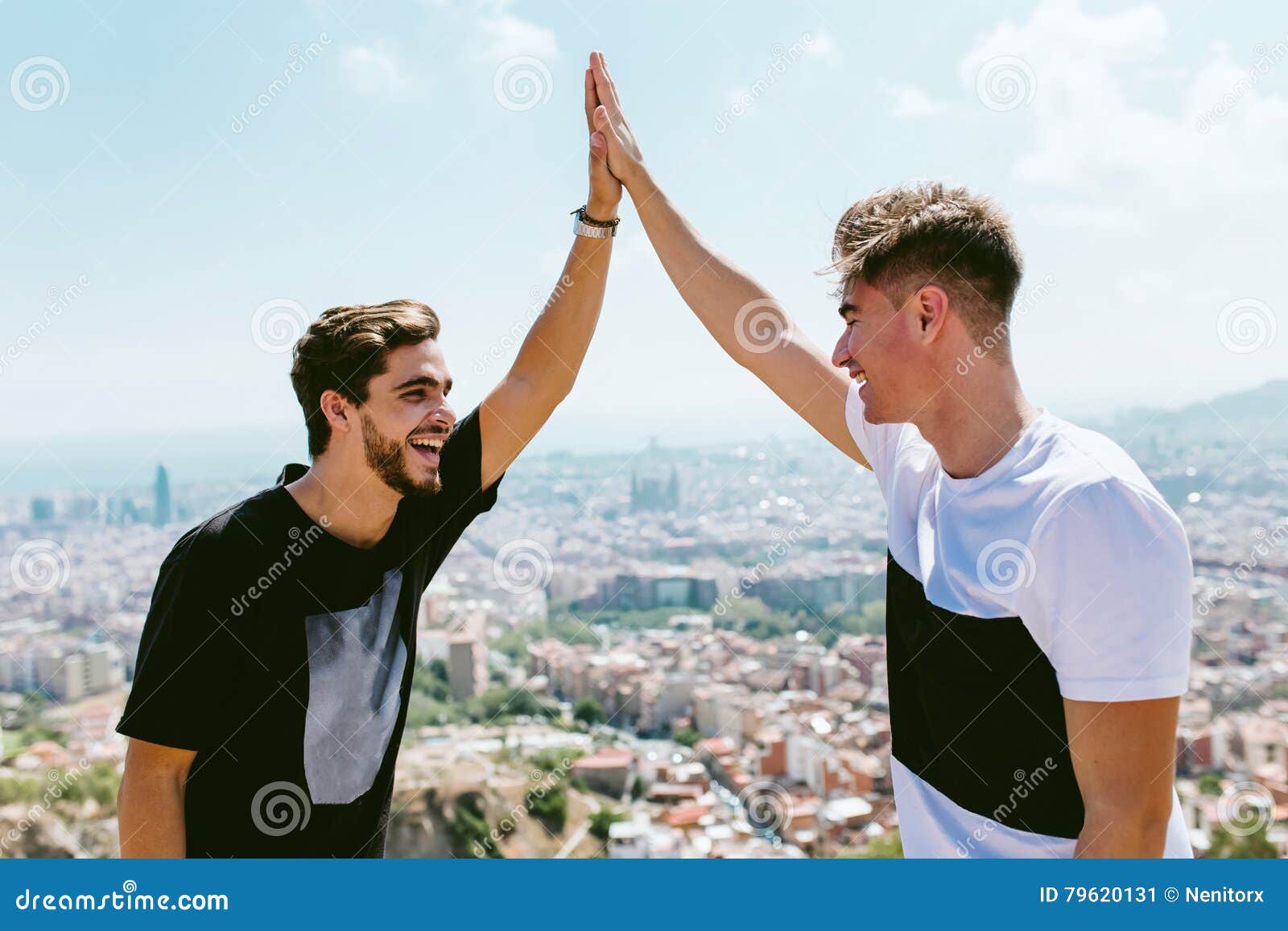 Two Young Men Looking at the Views Form the Top of a Mountain. Stock ...