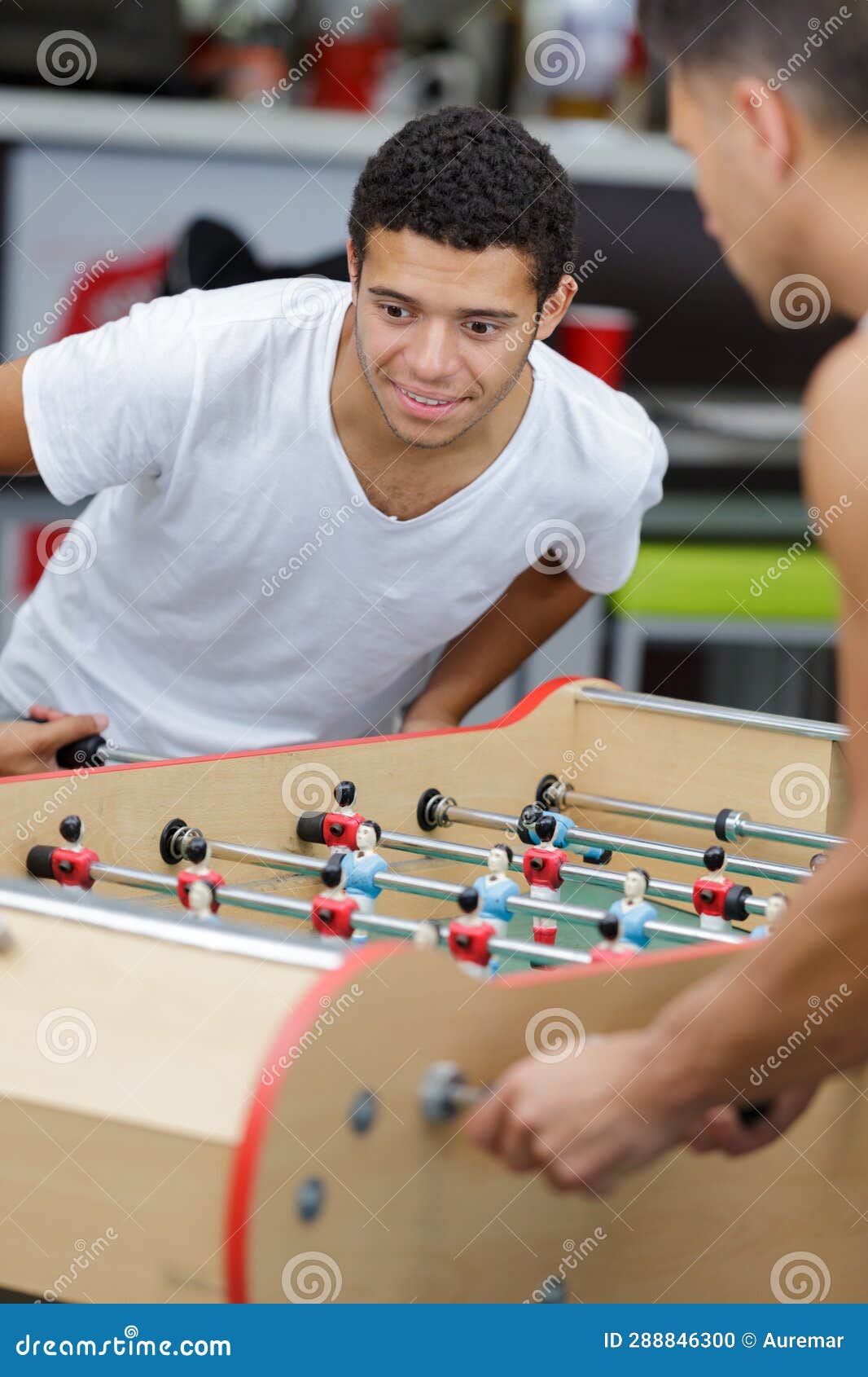 Two Young Men Playing Table Football Stock Photo - Image of real ...