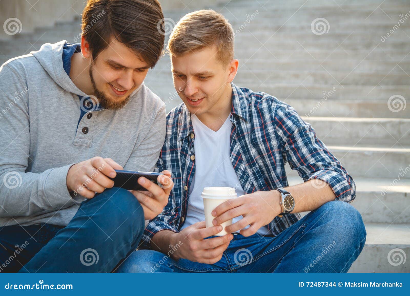 Two Young Men Sitting on the Steps Stock Photo - Image of cheerful ...