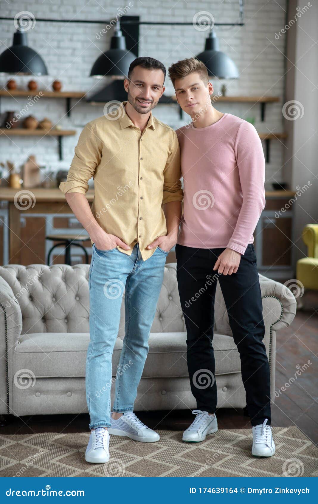 Two Young Men Standing Smiling Happily and Looking Good Stock Photo ... Two Young Men Standing Smiling Happily and Looking Good Stock Photo ...