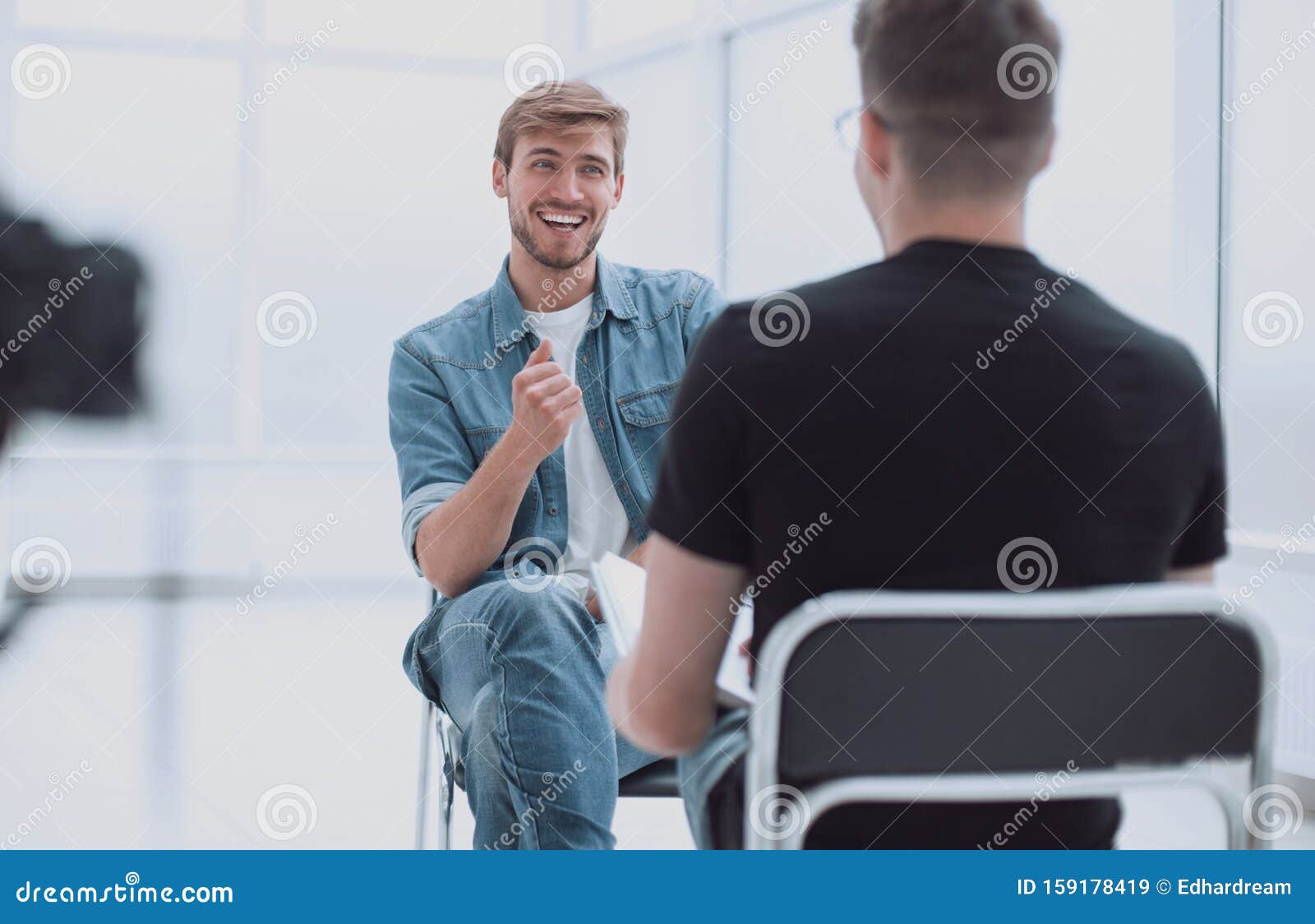 Two Young Men Talking in the TV Studio Stock Image - Image of ...
