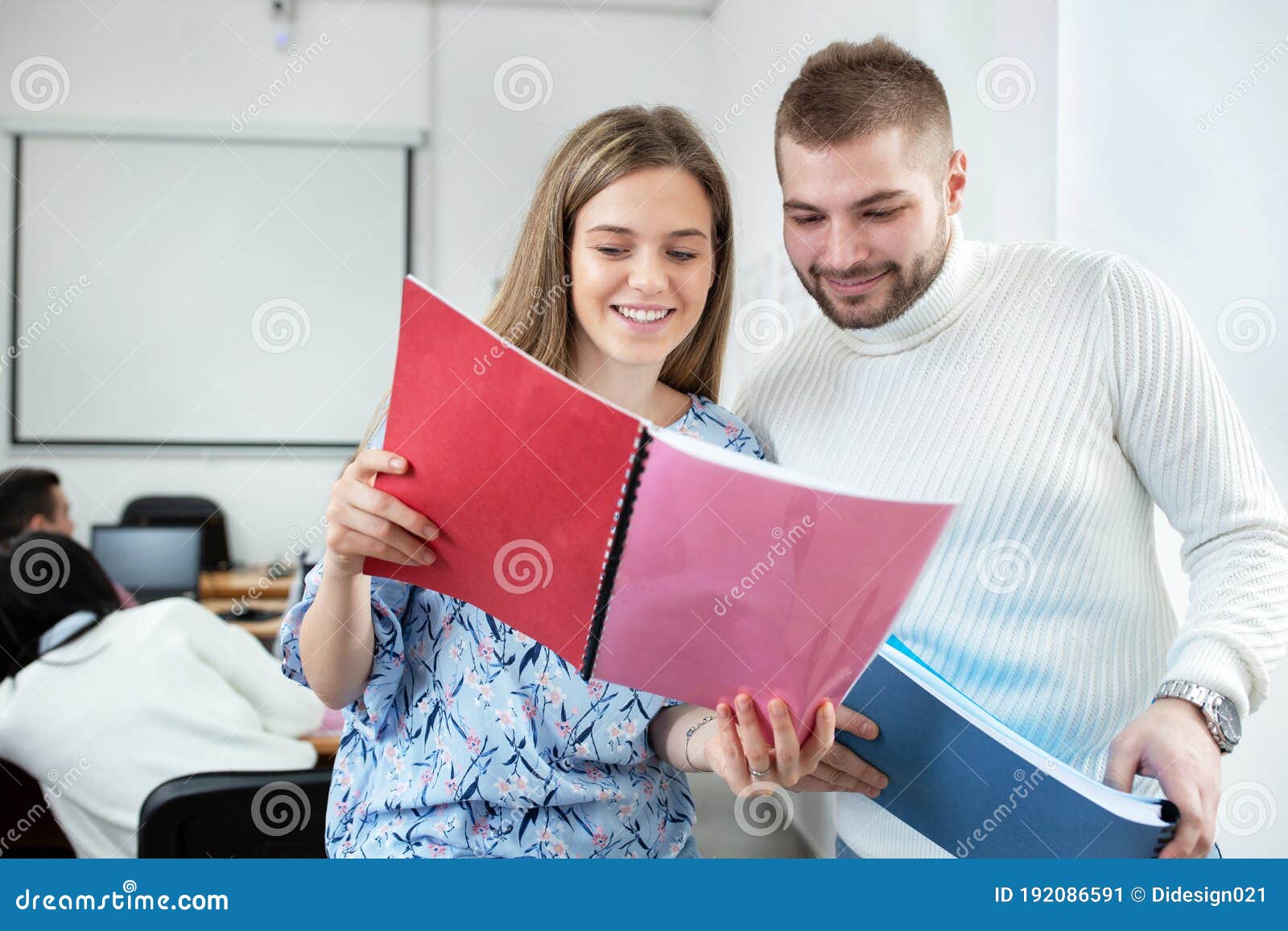 Two Young People in the Classroom Holding and Reading from the Script ...