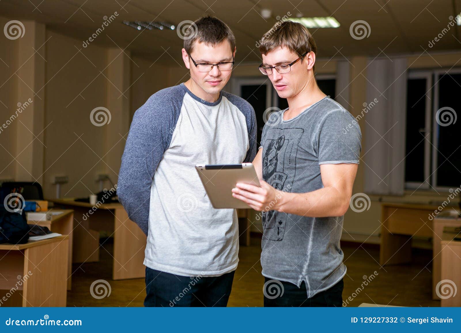 Two People Standing Next To Each Other With Their Han