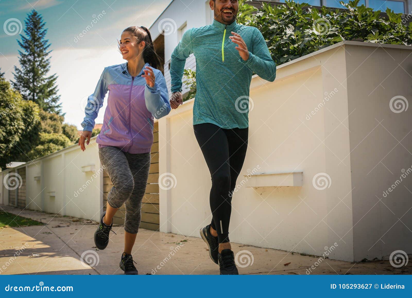 Two Young People Exercise Together Outside. Stock Image - Image of ...