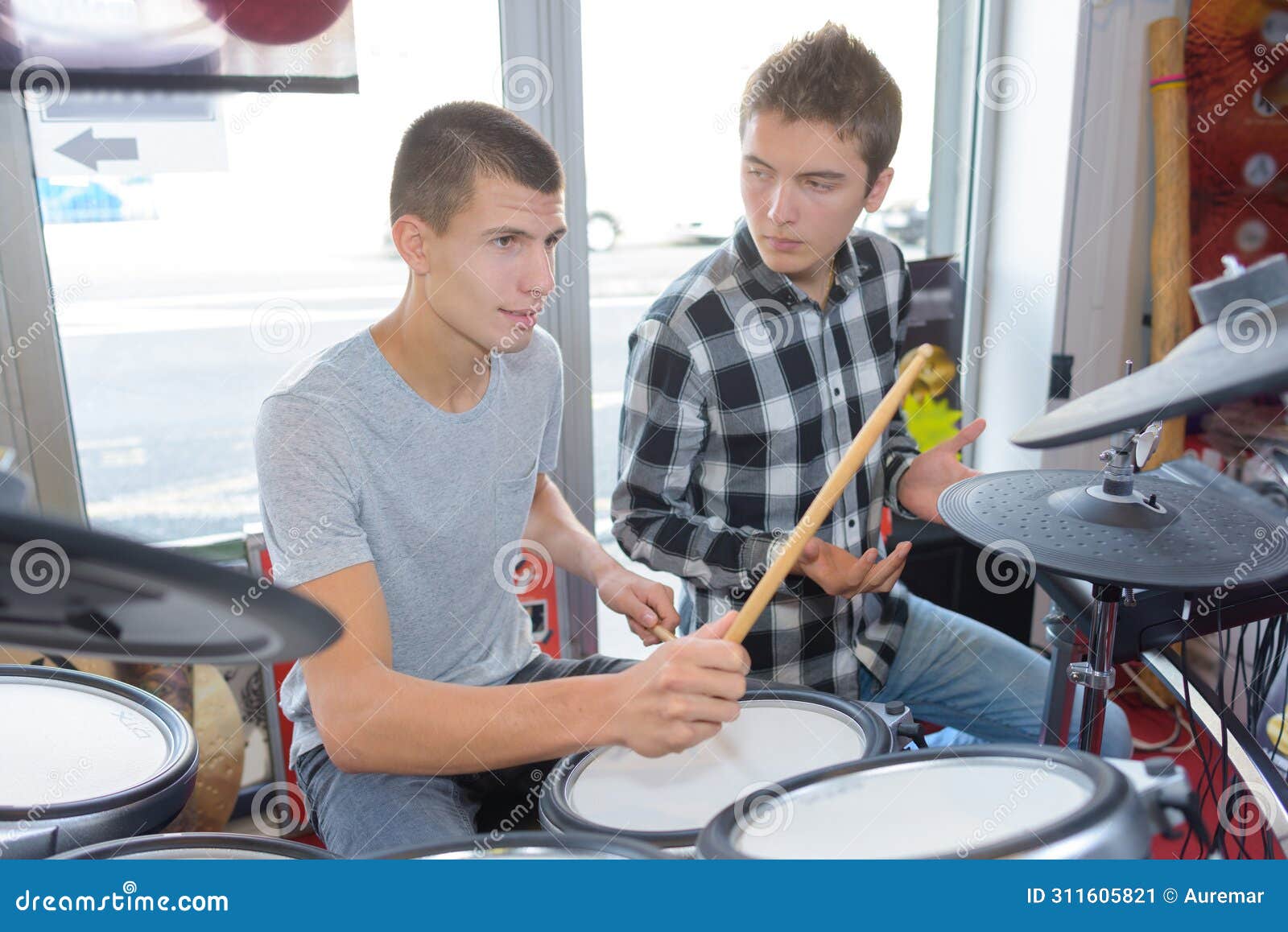 Two Young People Playing Drums Stock Image - Image of drum, stick ...