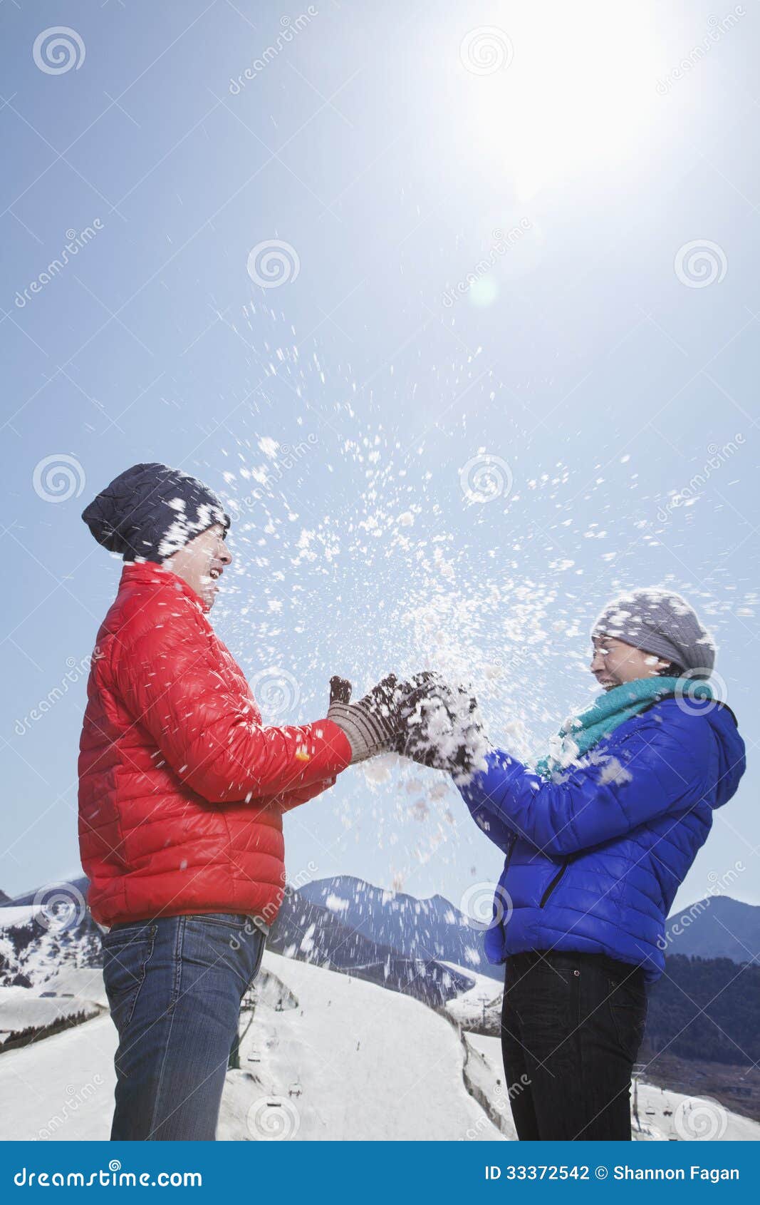 Two Young People Playing with Snow Stock Photo - Image of people, eyes ...