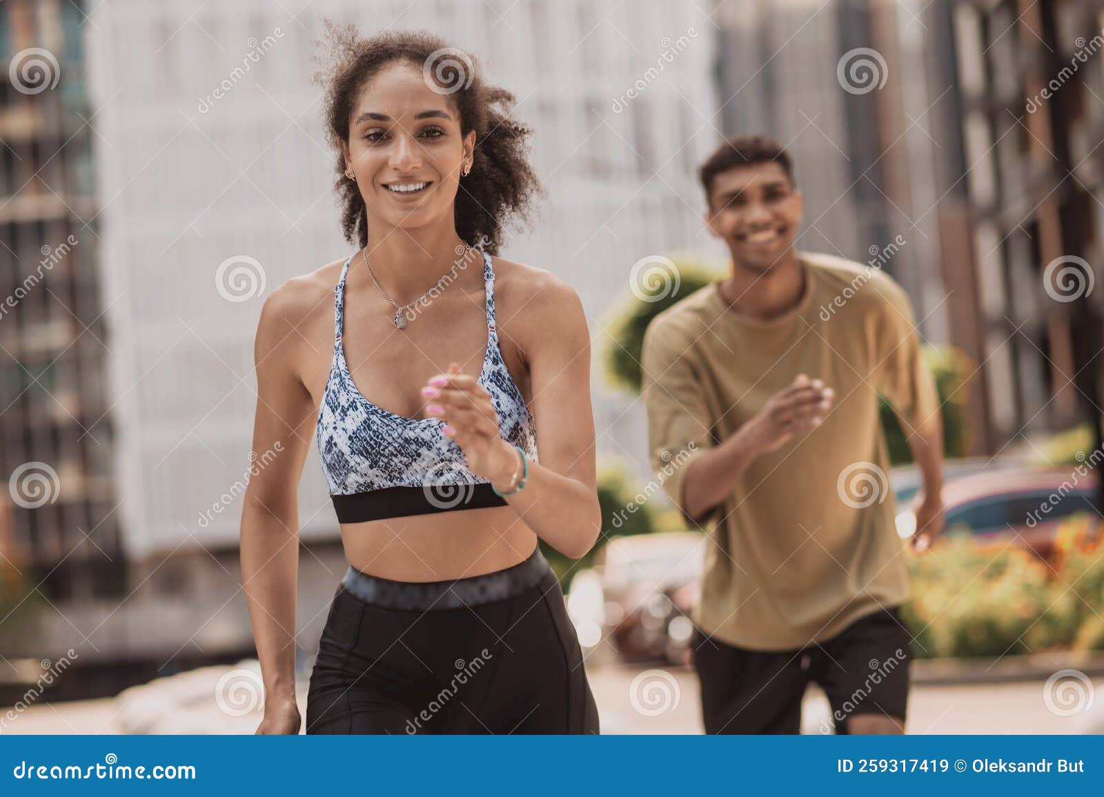 Two Young People Running and Smiling Stock Image - Image of adult ...
