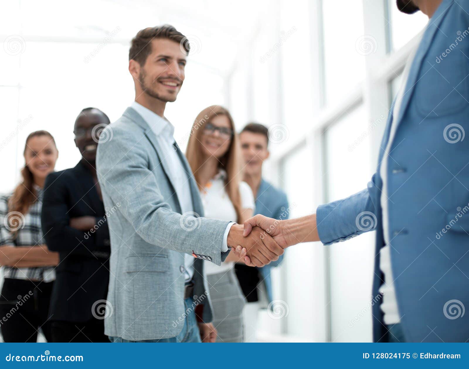 Two Young People Shake Hands Stock Image - Image of male, agreement ...