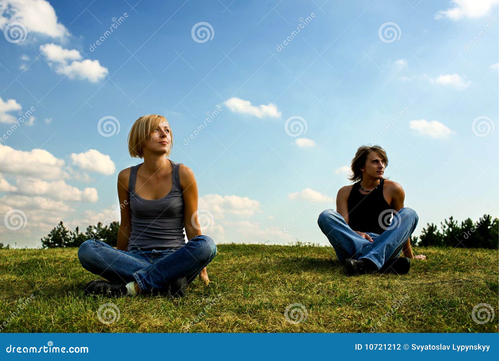Two Young People Sitting on the Grass Stock Photo - Image of love ...