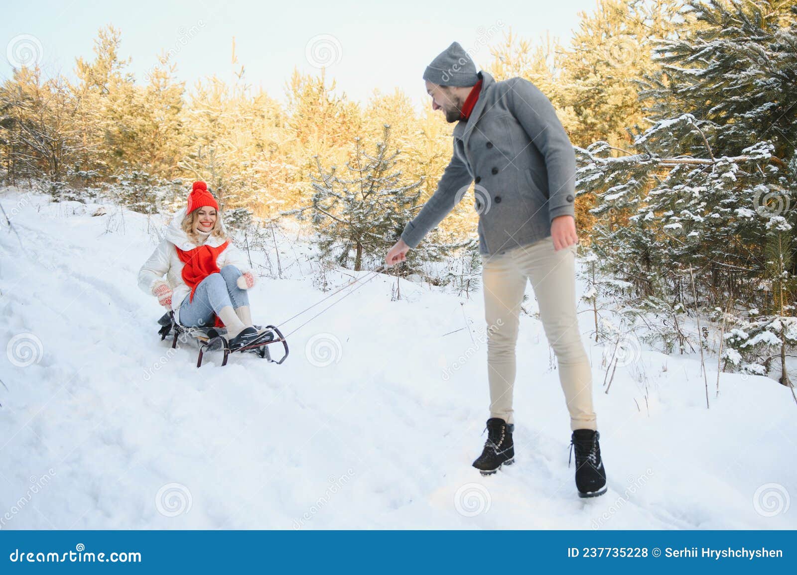 Two Young People Sliding on a Sled Stock Photo - Image of outdoors ...