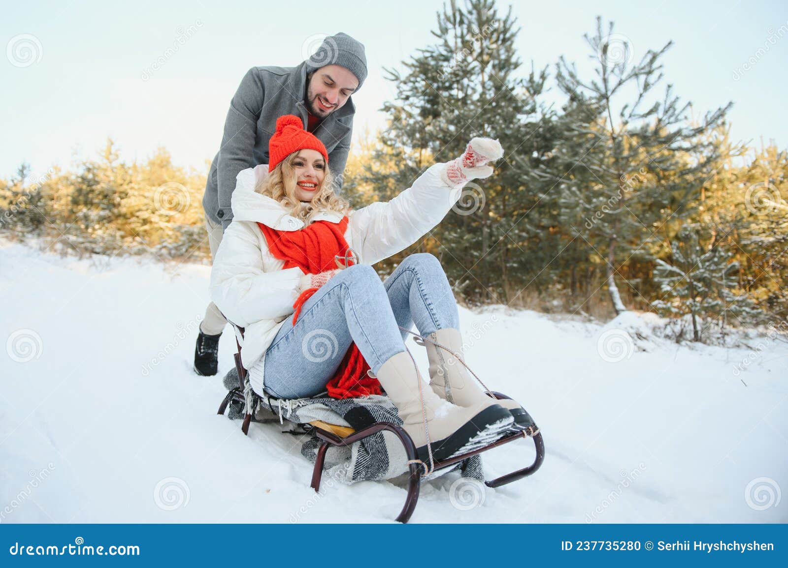 Two Young People Sliding on a Sled Stock Photo - Image of outdoors ...