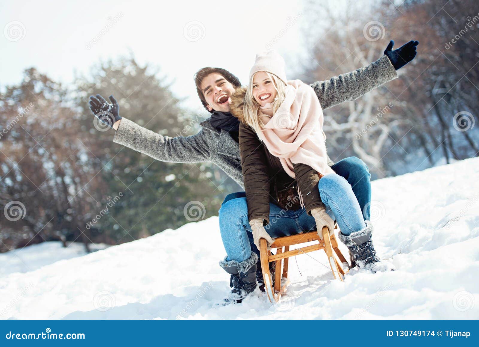 Two Young People Sliding on a Sled Stock Photo - Image of sleigh ...